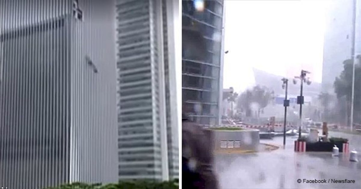 Reporter stood next to a skyscraper just as a huge pane of glass fell ...