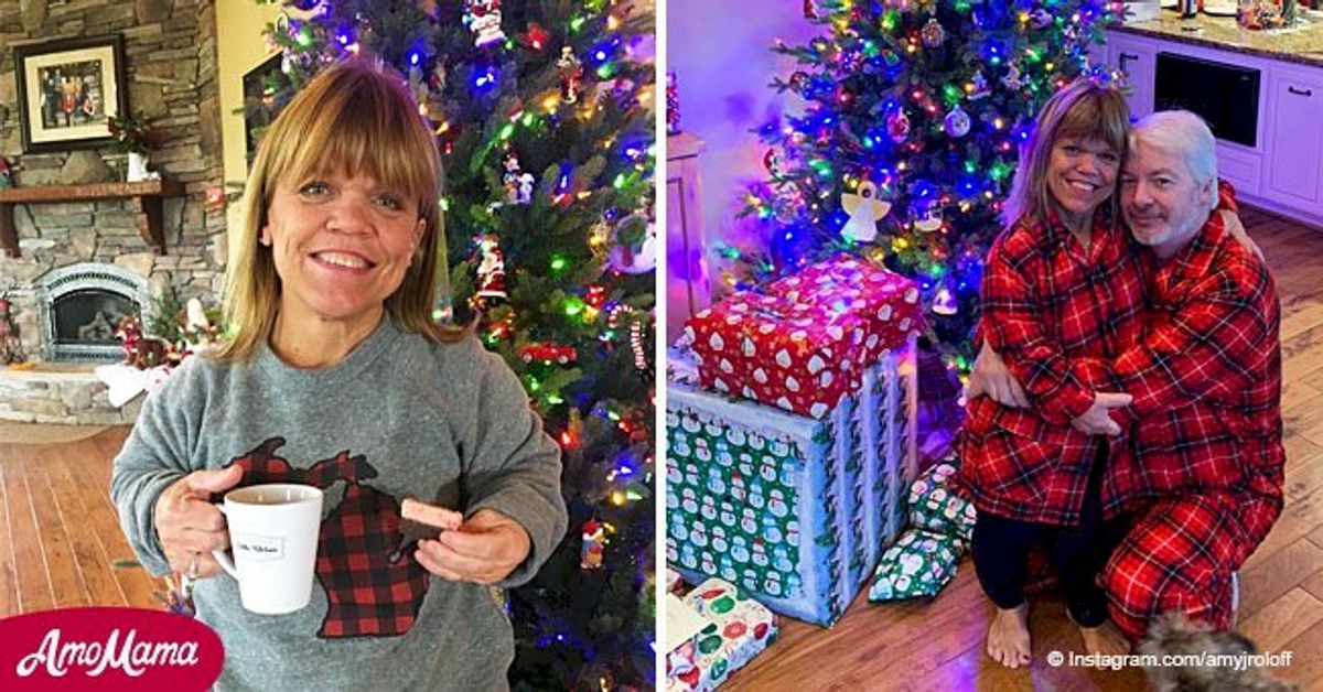 Amy Roloff hugs her boyfriend wearing matching pajamas posing under a ...