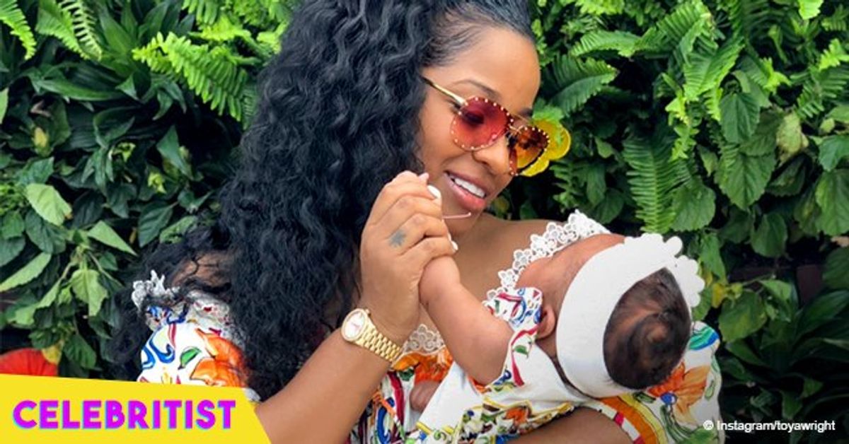 Toya Wright shows off Baby Reign Rushing rocking butterfly costume at a ...