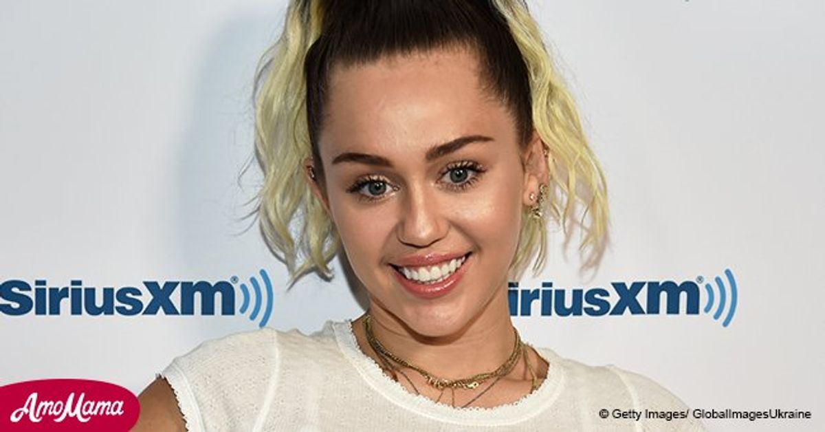 Miley Cyrus flaunts her toned abs as she rocks a tiny cropped top while ...