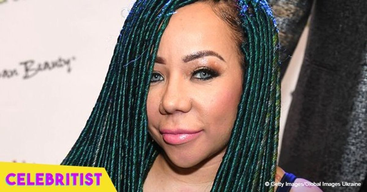 Tiny Harris debuts grey hair color posing in matching outfits with ...