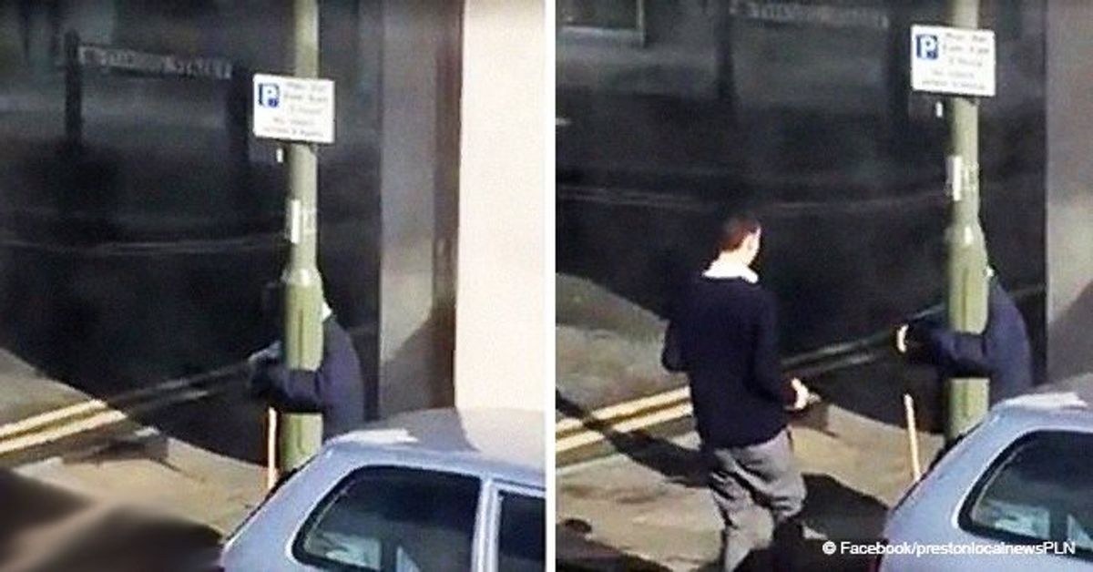 Young man spots terrified elderly woman clinging to a lamp post and ...