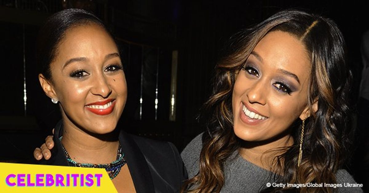 Tia and Tamera Mowry rock long afro hair and identical outfits in ...
