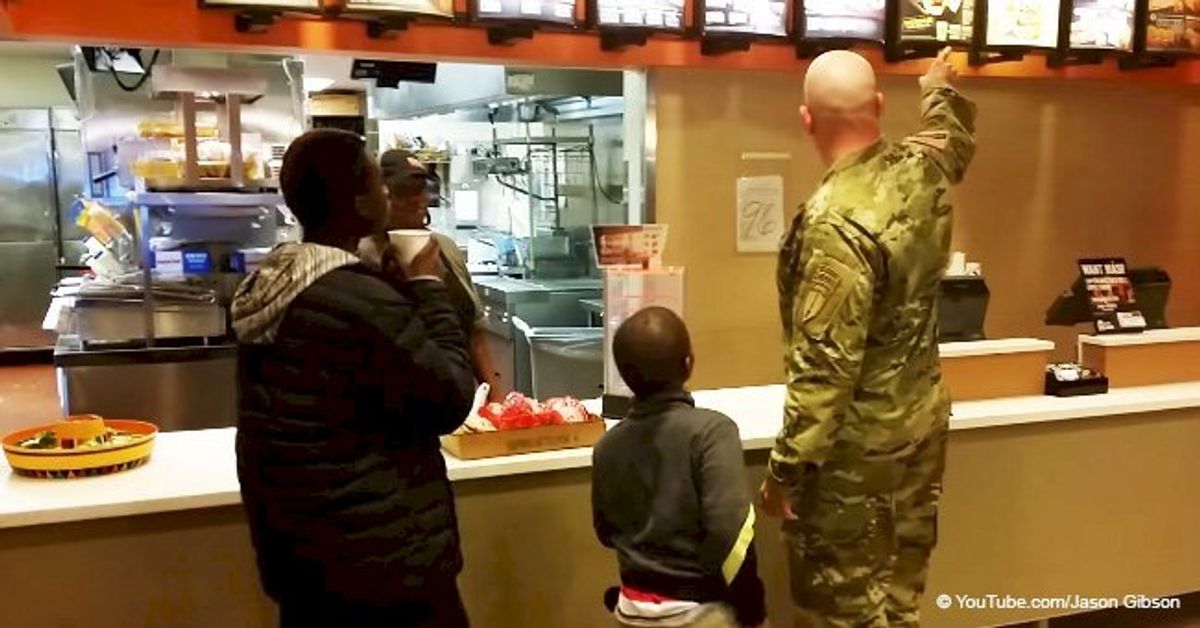 Heartwarming moment a soldier feeds two hungry little boys and his good ...