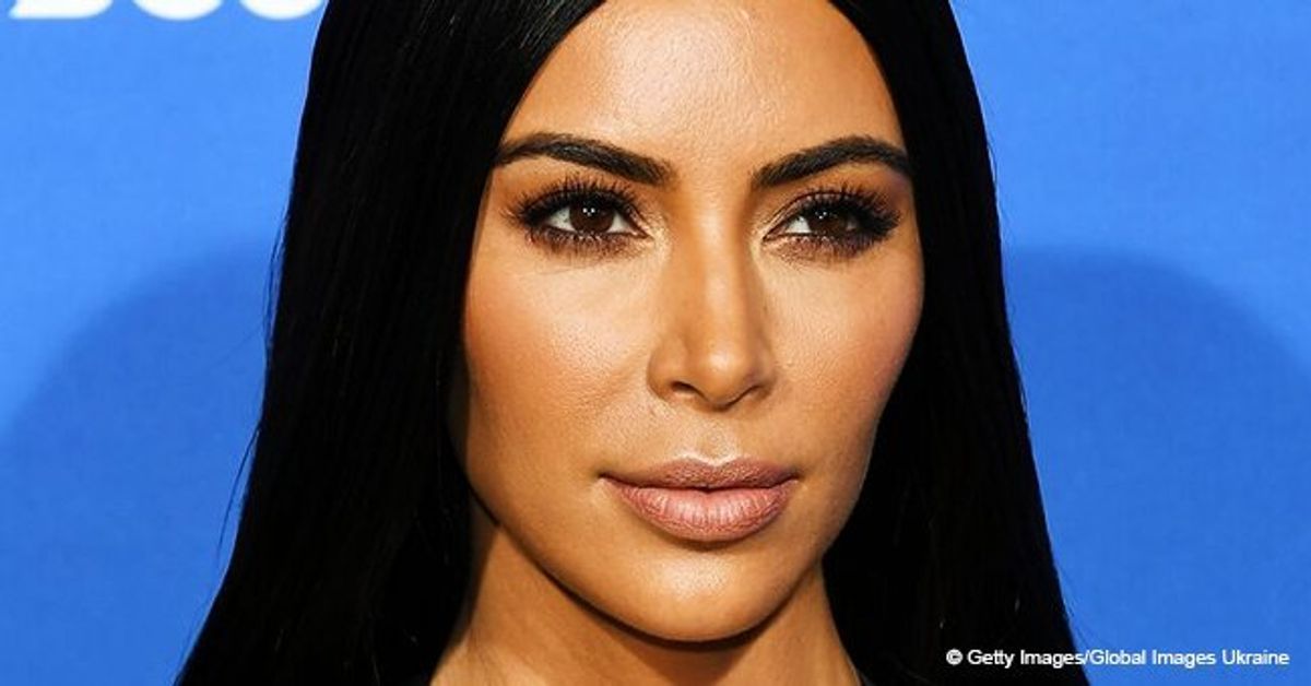 Kim K. ditches bra in new pic as she rocks low-cut shirt dress at 20 ...