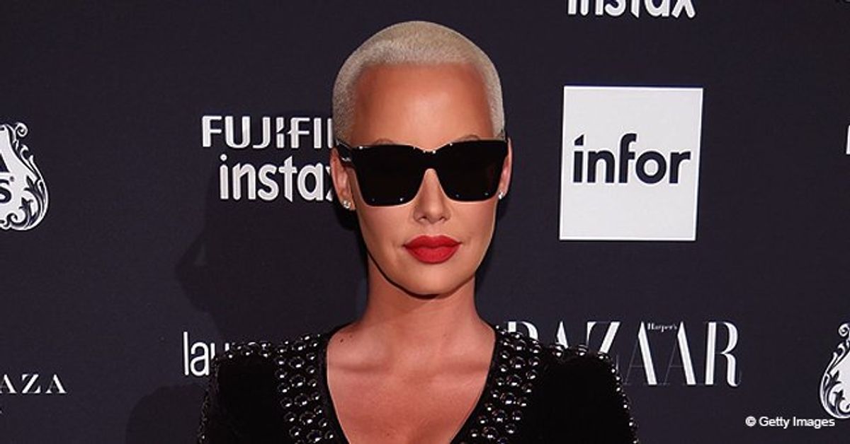 Amber Rose Looks Stunning Posing Poolside in a Tight Fitting Orange Dress