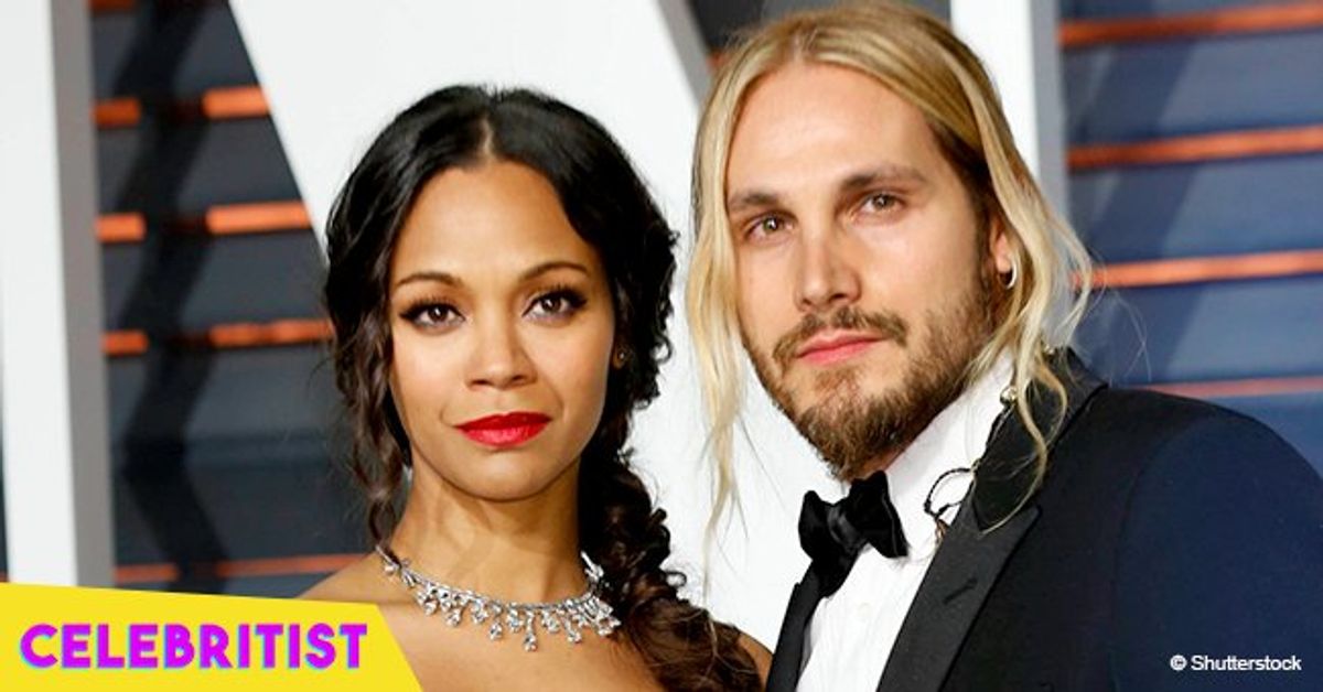 Zoe Saldana and husband carry 3-year-old twins on their shoulders in ...