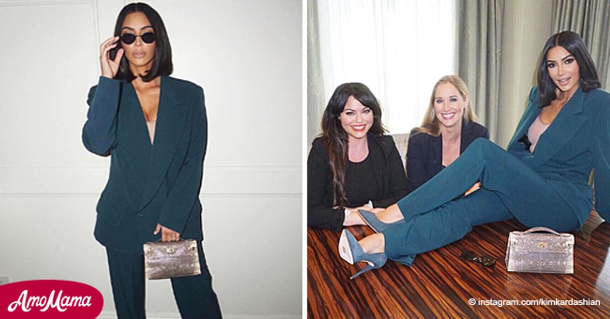 Kim Kardashian Looks Like a Boss Perched on Top of a Table during Her ...